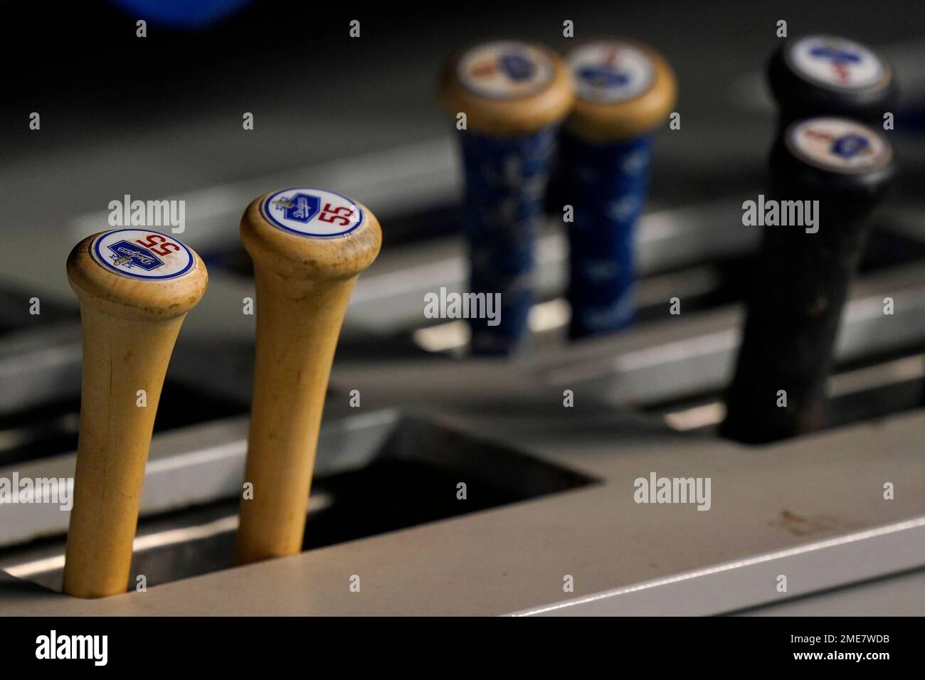Baseball bats are shown in the visitor's dugout before the start of a ...
