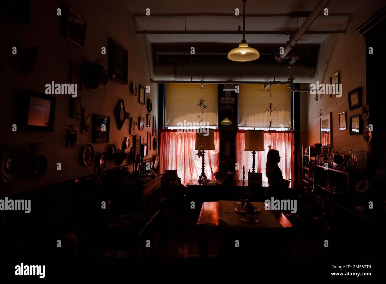 Cora Anderson, 9, from Macon, Ill., is silhouetted as she walks through ...