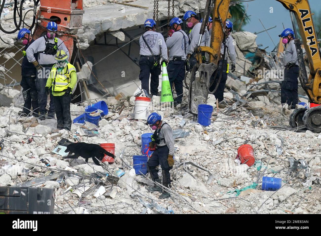 Rescue crews work at the site of the collapsed Champlain Towers South ...