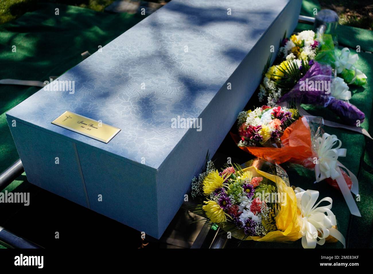The casket of James Brown sits atop its resting place at a cemetery in ...