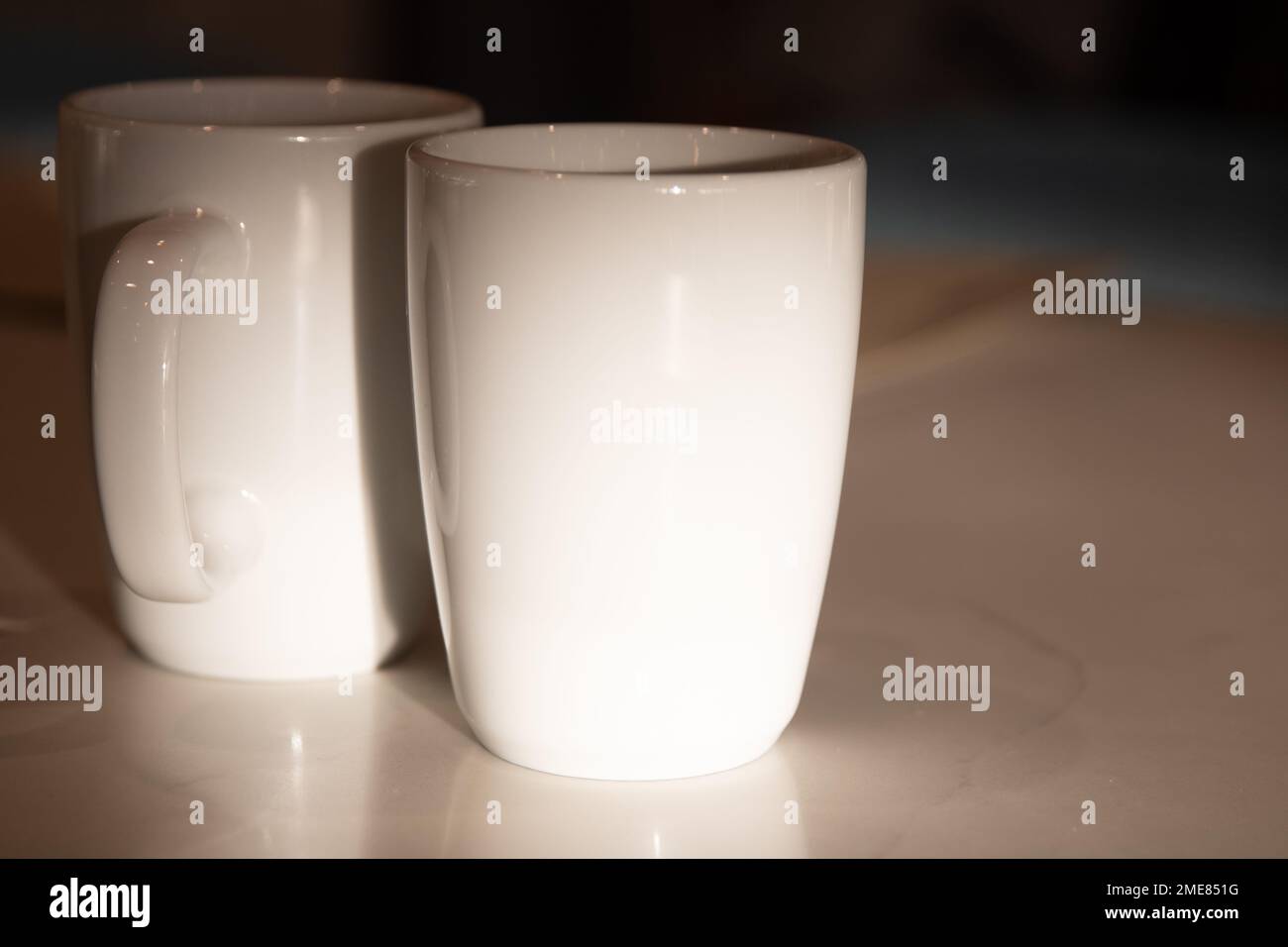 Two blank coffee mugs with copy space Stock Photo - Alamy