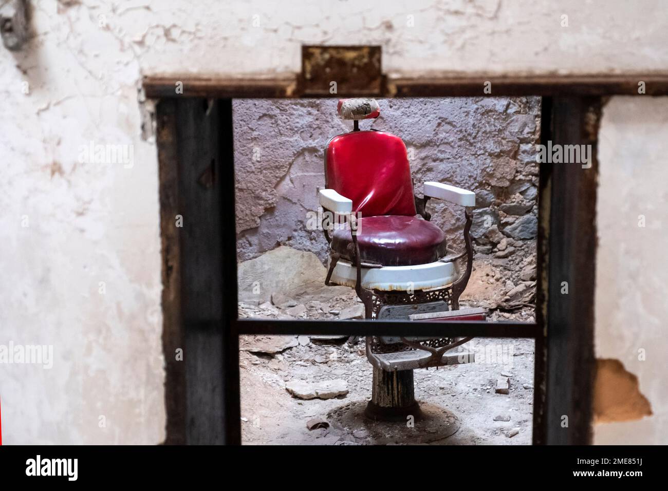 A prison cell with a barber chair in Eastern State Penitentiary is seen ...
