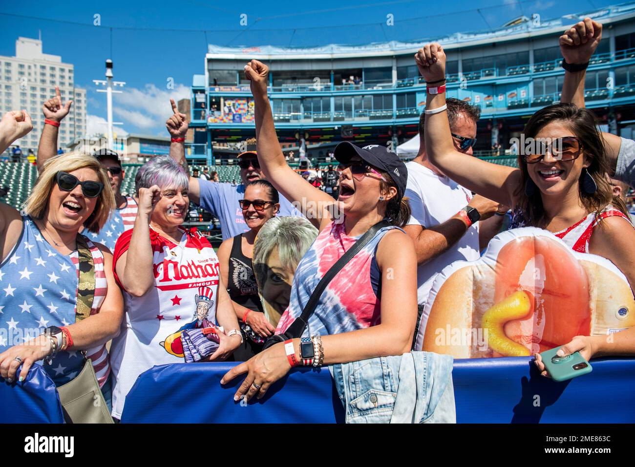 Fans cheer on contestant Larell Marie Mele, left, before going onstage ...