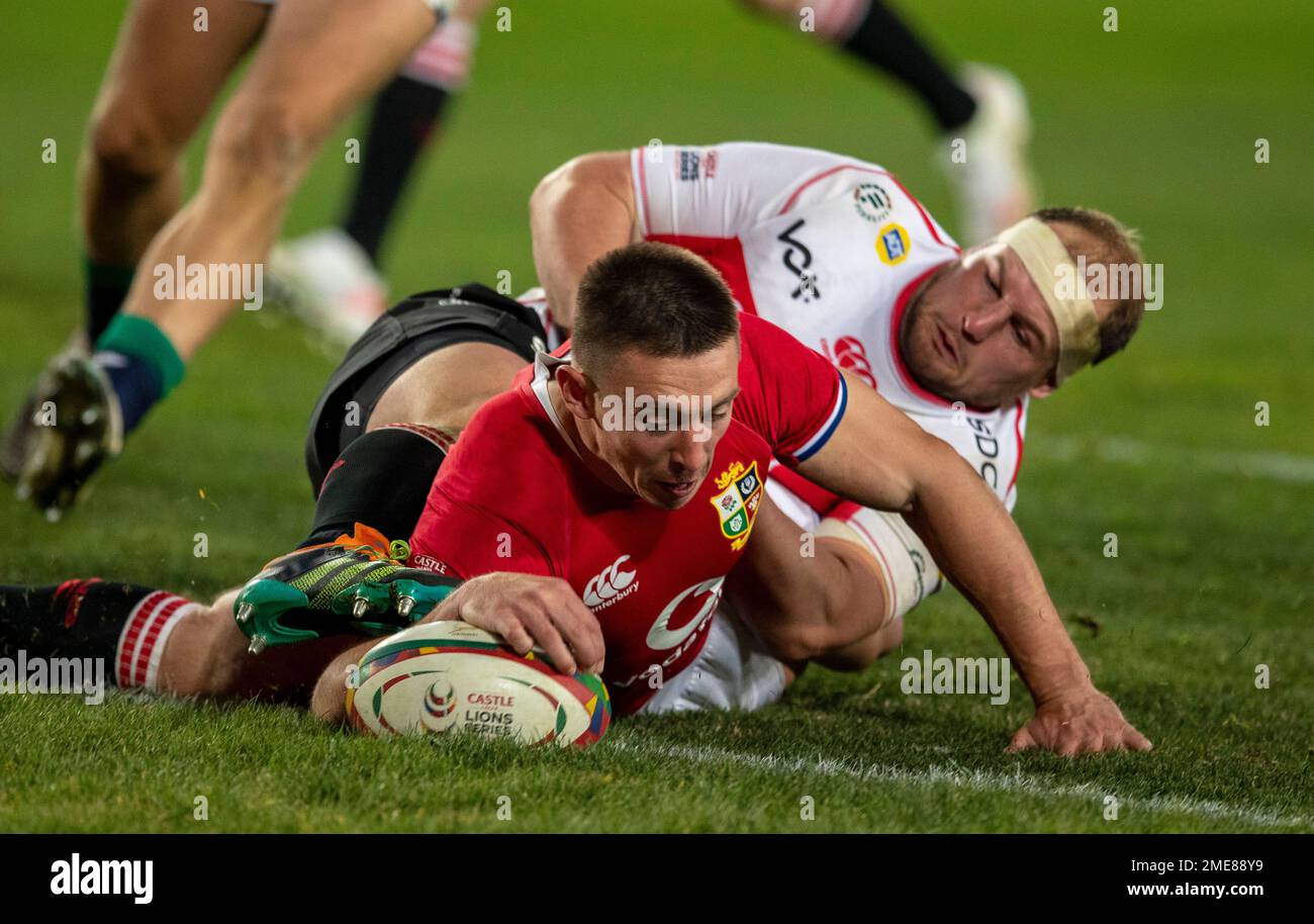 British and Irish Lions' Josh Adams, left, scores a try as South ...