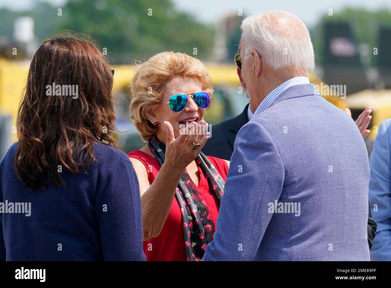 President Joe Biden is greeted by Michigan Gov. Gretchen Whitmer, left ...