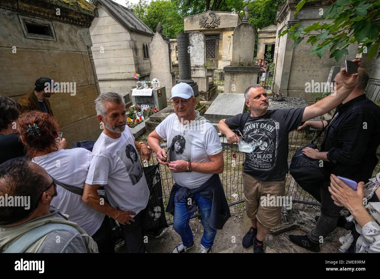 Fans gather at the tomb of rock singer Jim Morrison at the Pere ...