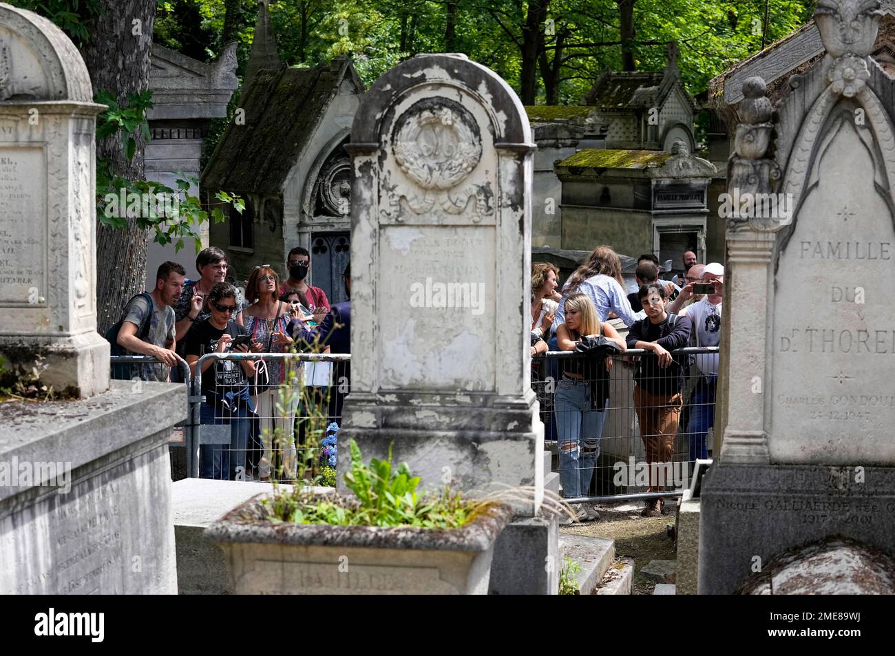 Fans gather at the tomb of rock singer Jim Morrison at the Pere ...