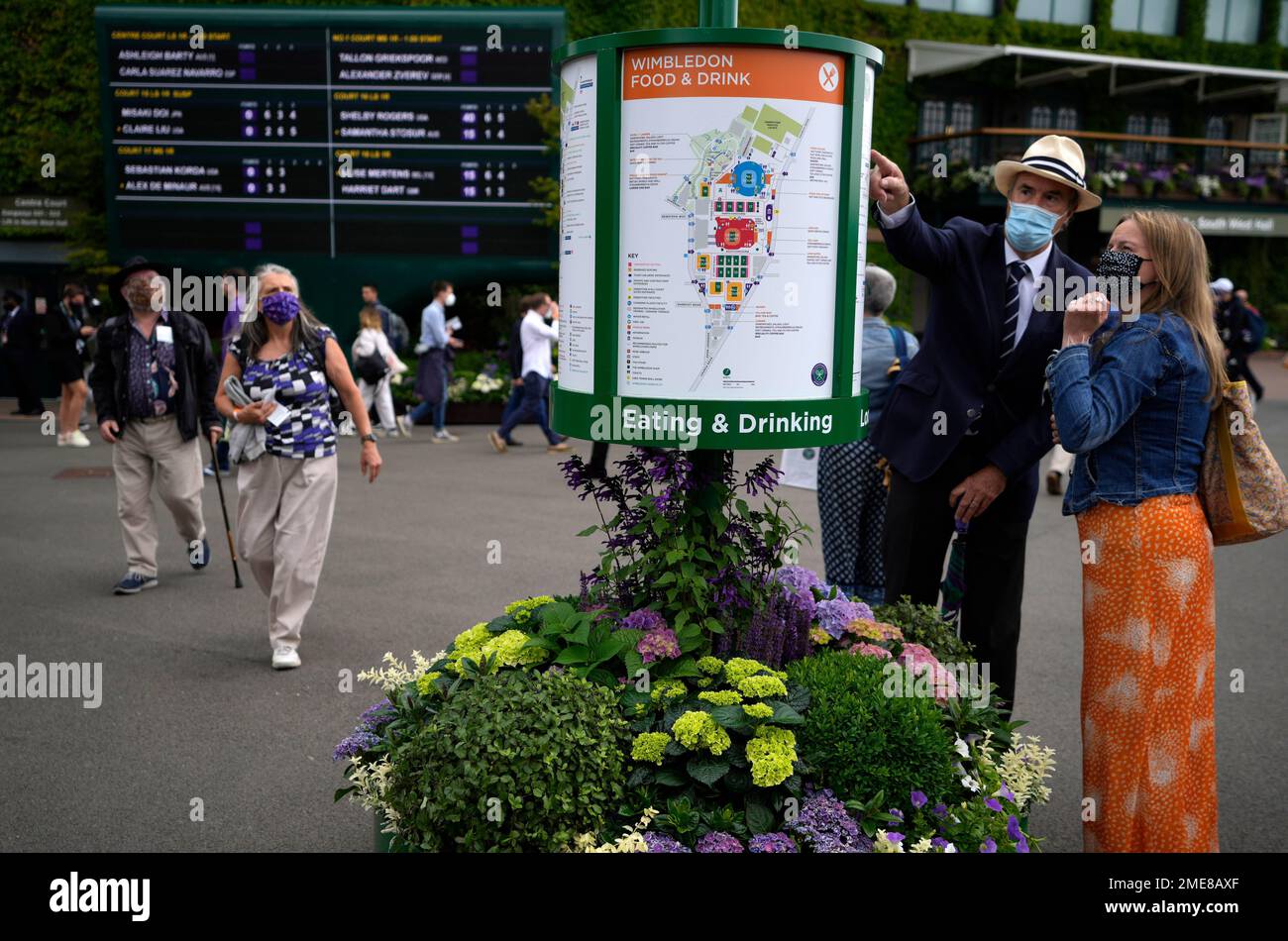 People walk around the grounds of the Wimbledon Tennis Championships in ...