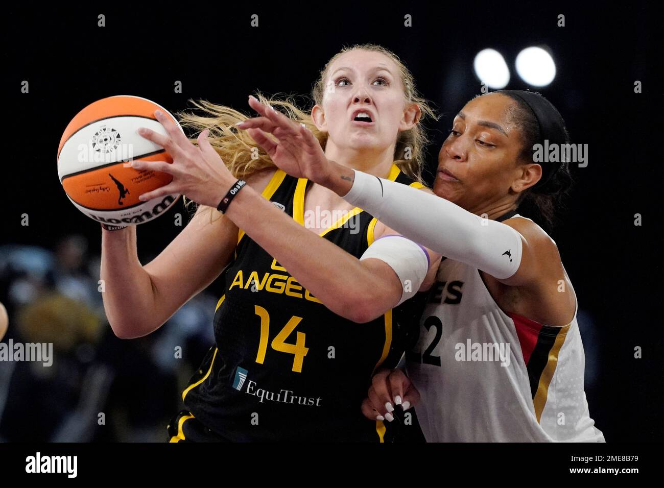 Los Angeles Sparks forward Lauren Cox, left, shoots as Las Vegas Aces ...