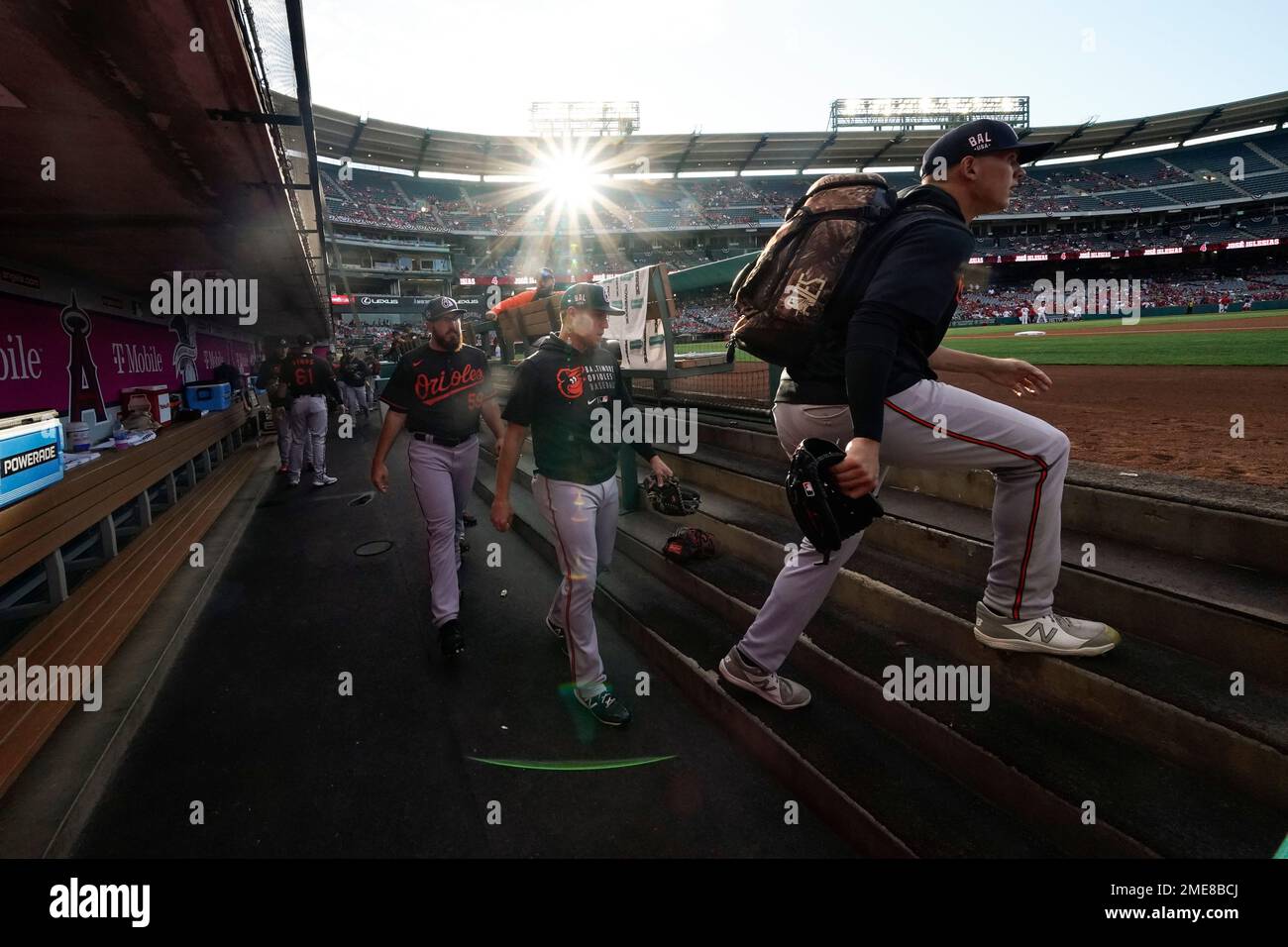 The Baltimore Orioles leave the dugout to warm up before a baseball ...