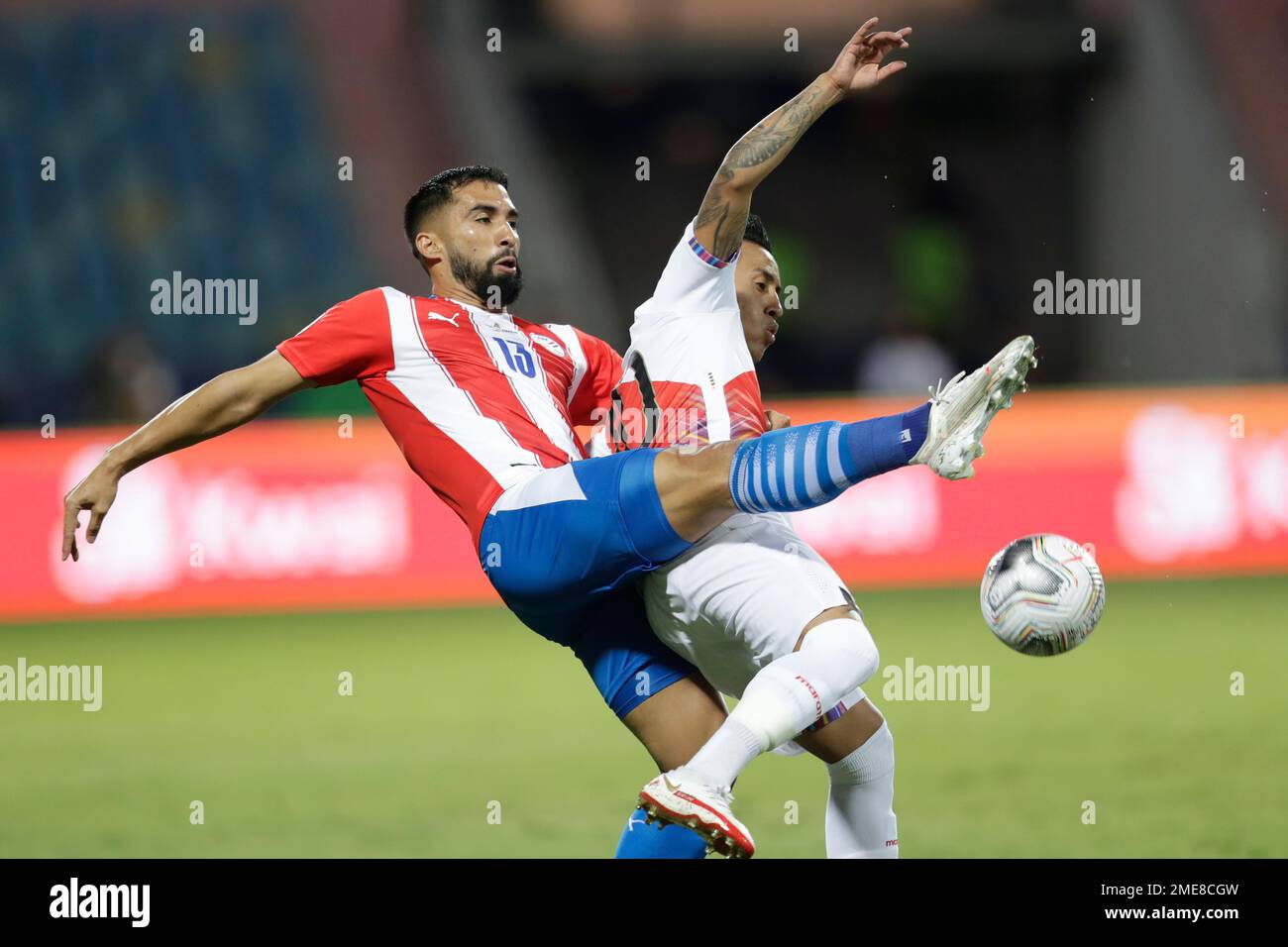 Peru's Christian Cueva, right, and Paraguay's Alberto Espinola battle ...