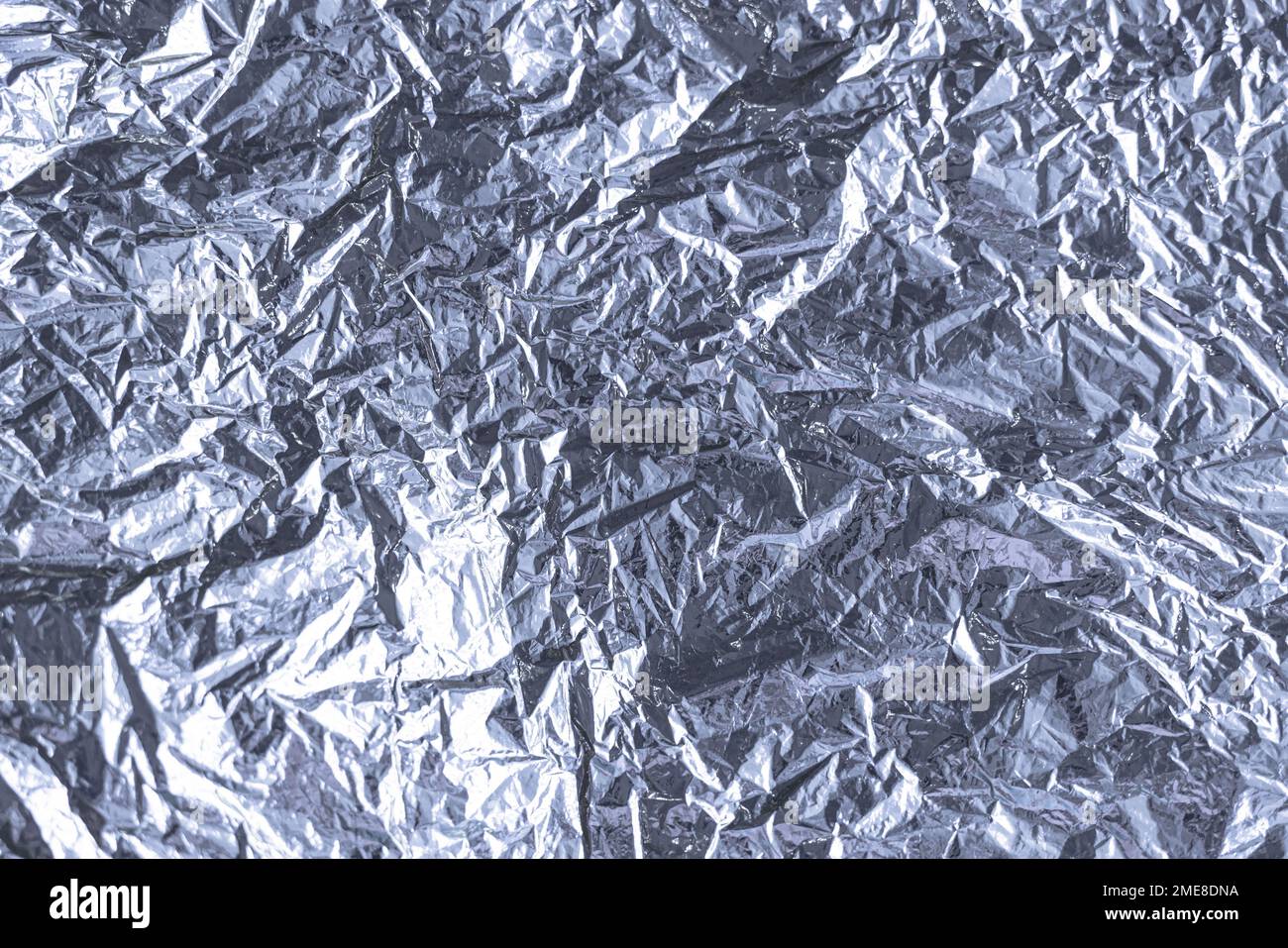 Silver crumpled foil metallic luster holographic effect Stock Photo - Alamy