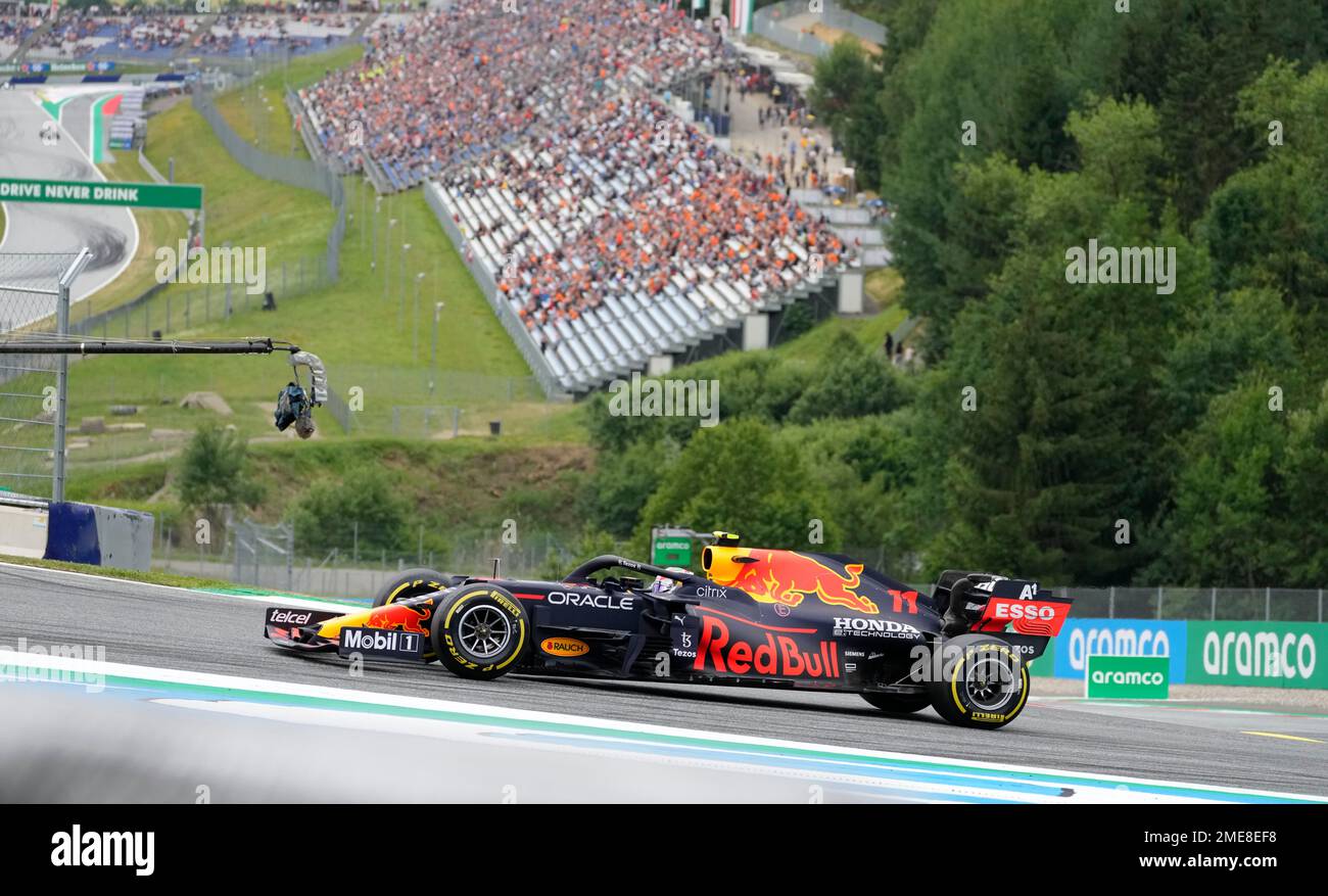 Red Bull driver Sergio Perez of Mexico steers his car during the second free practice session ...