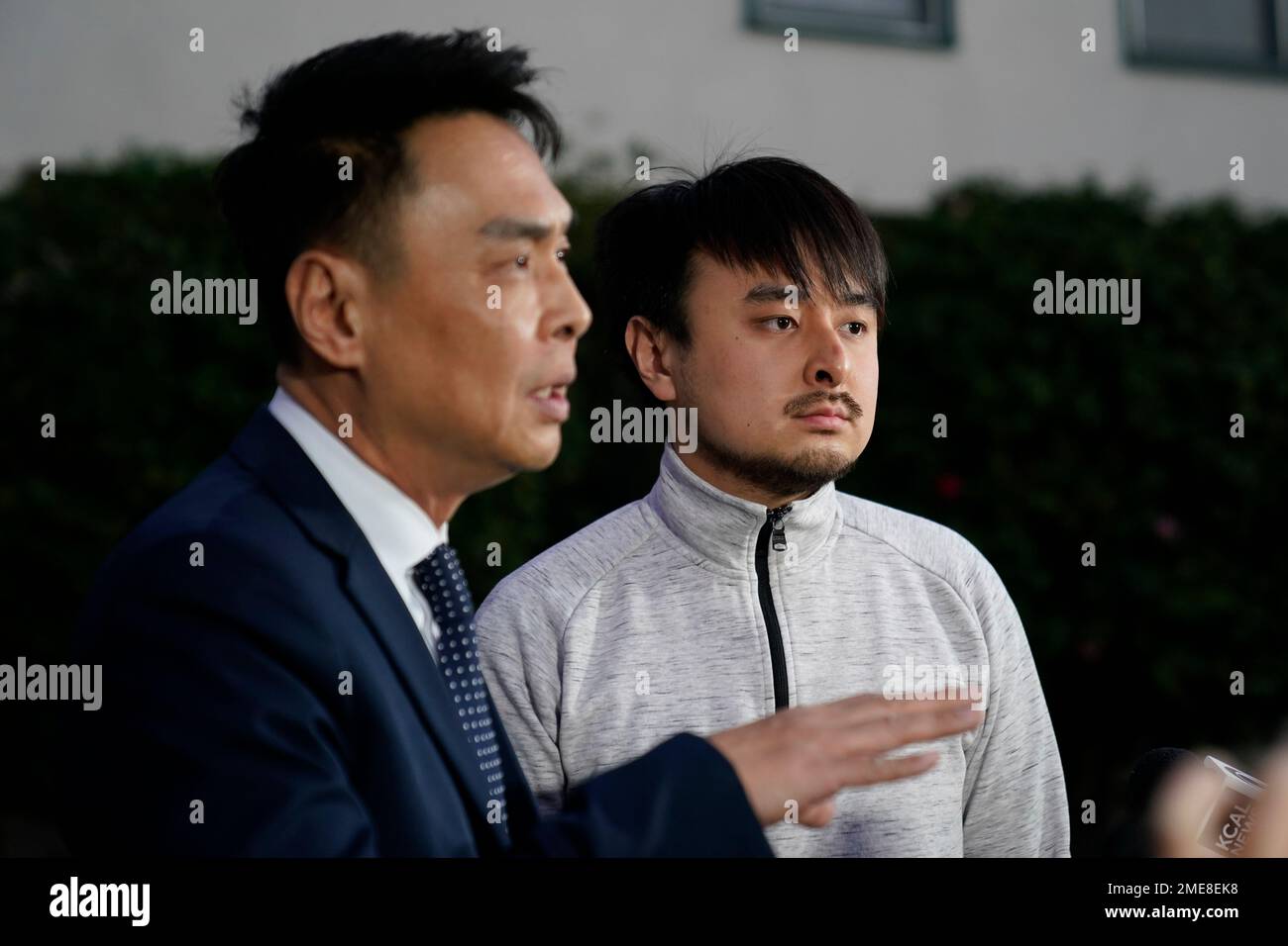 Brandon Tsay, 26, right, and his father, Tom Tsay, make a statement ...