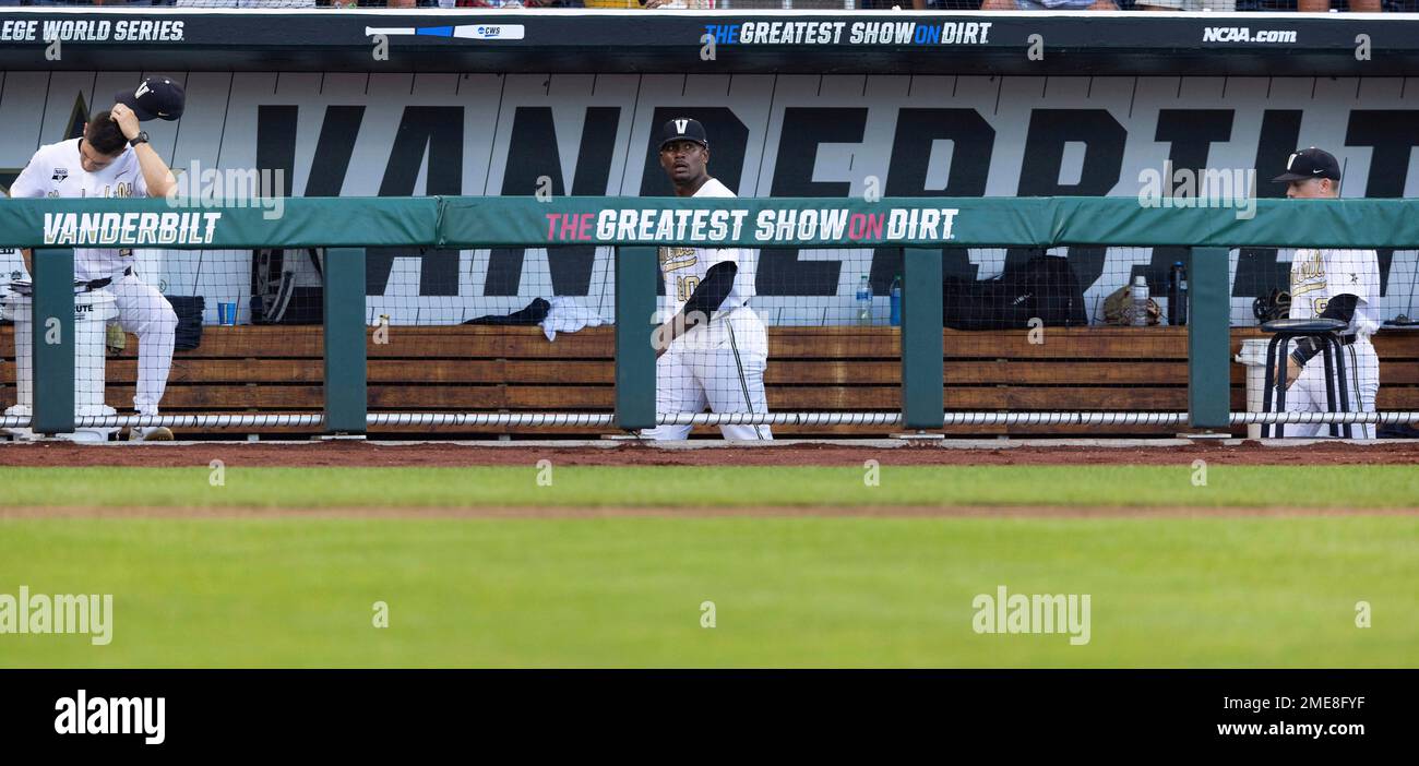 Vanderbilt starting pitcher Kumar Rocker, center, returns to the dugout ...