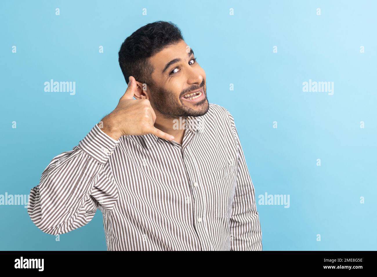You contact us. Portrait of positive businessman with beard making ...