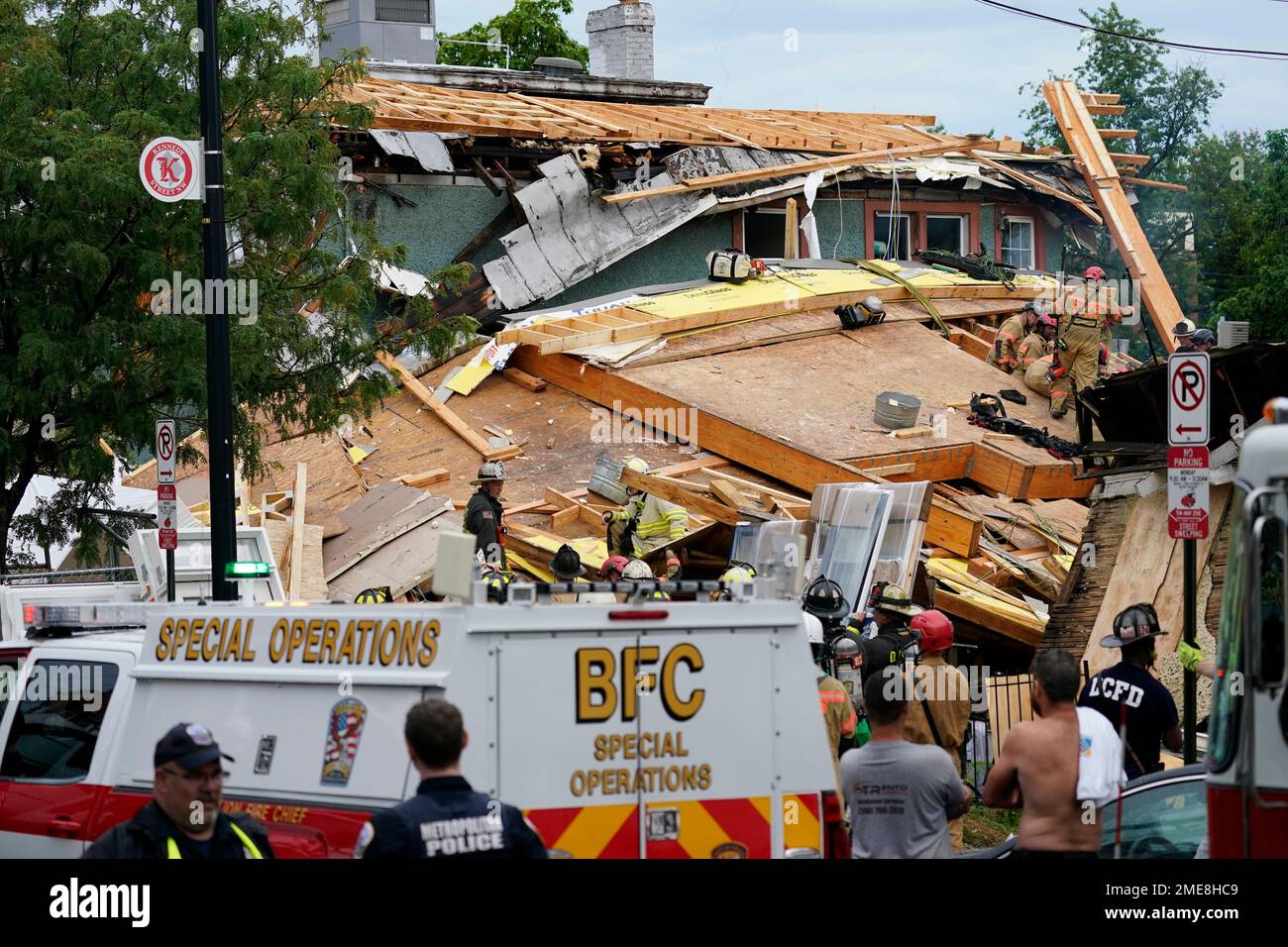 Emergency crews respond after a building under construction collapsed ...