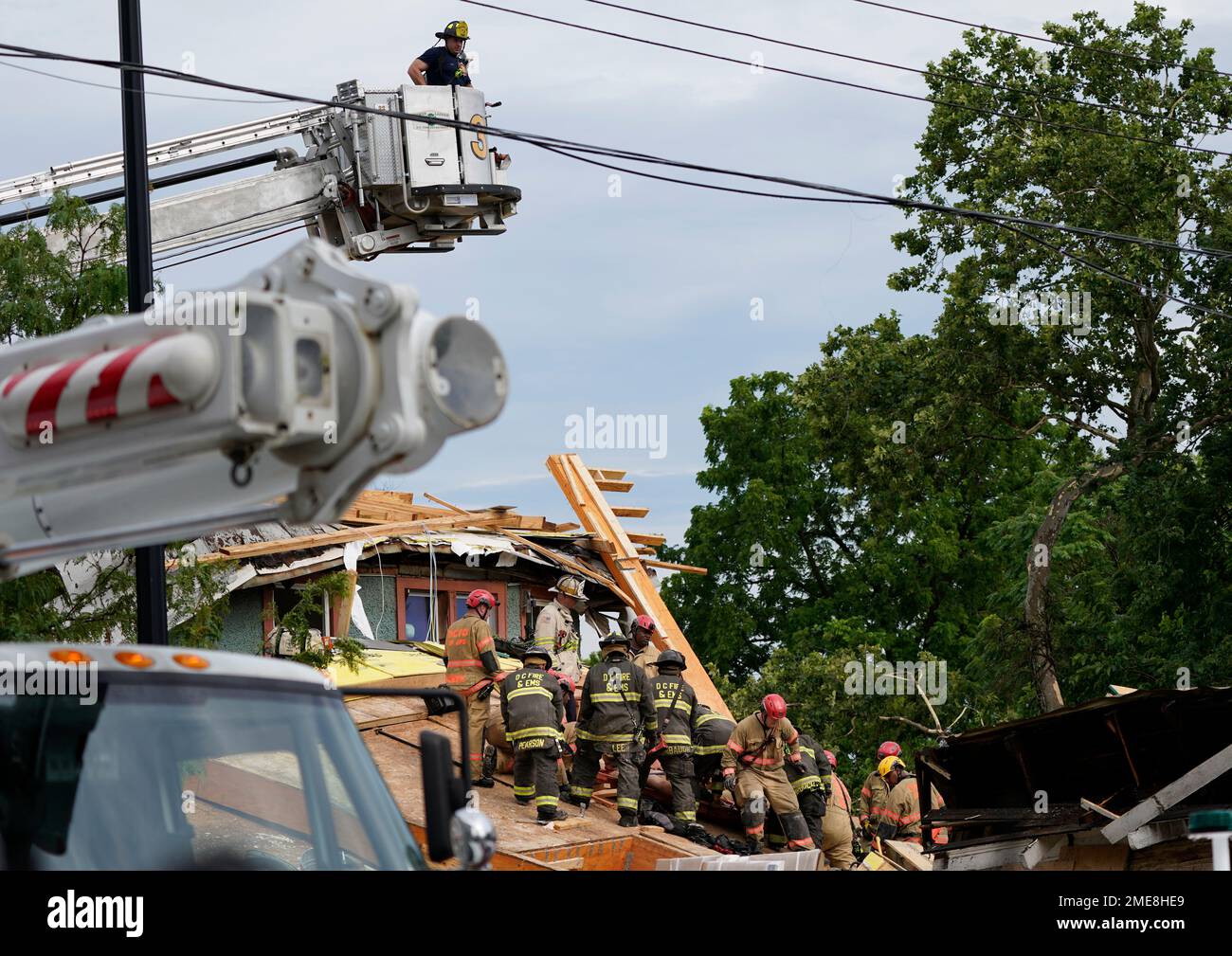 Emergency crews work to rescue a trapped construction worker after ...