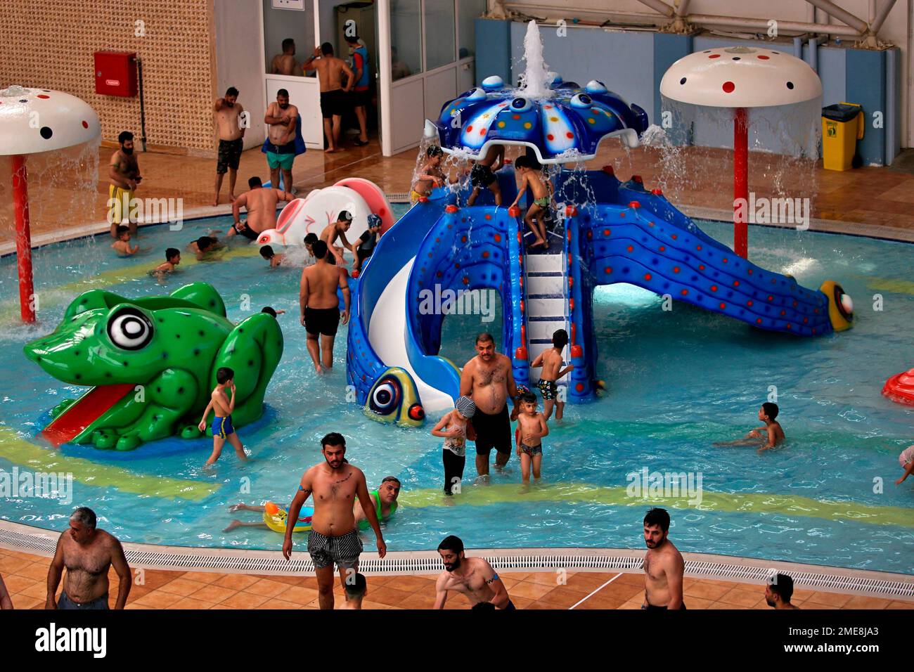 People escape the searing summer heat at Baghdad Aquatic Center in ...