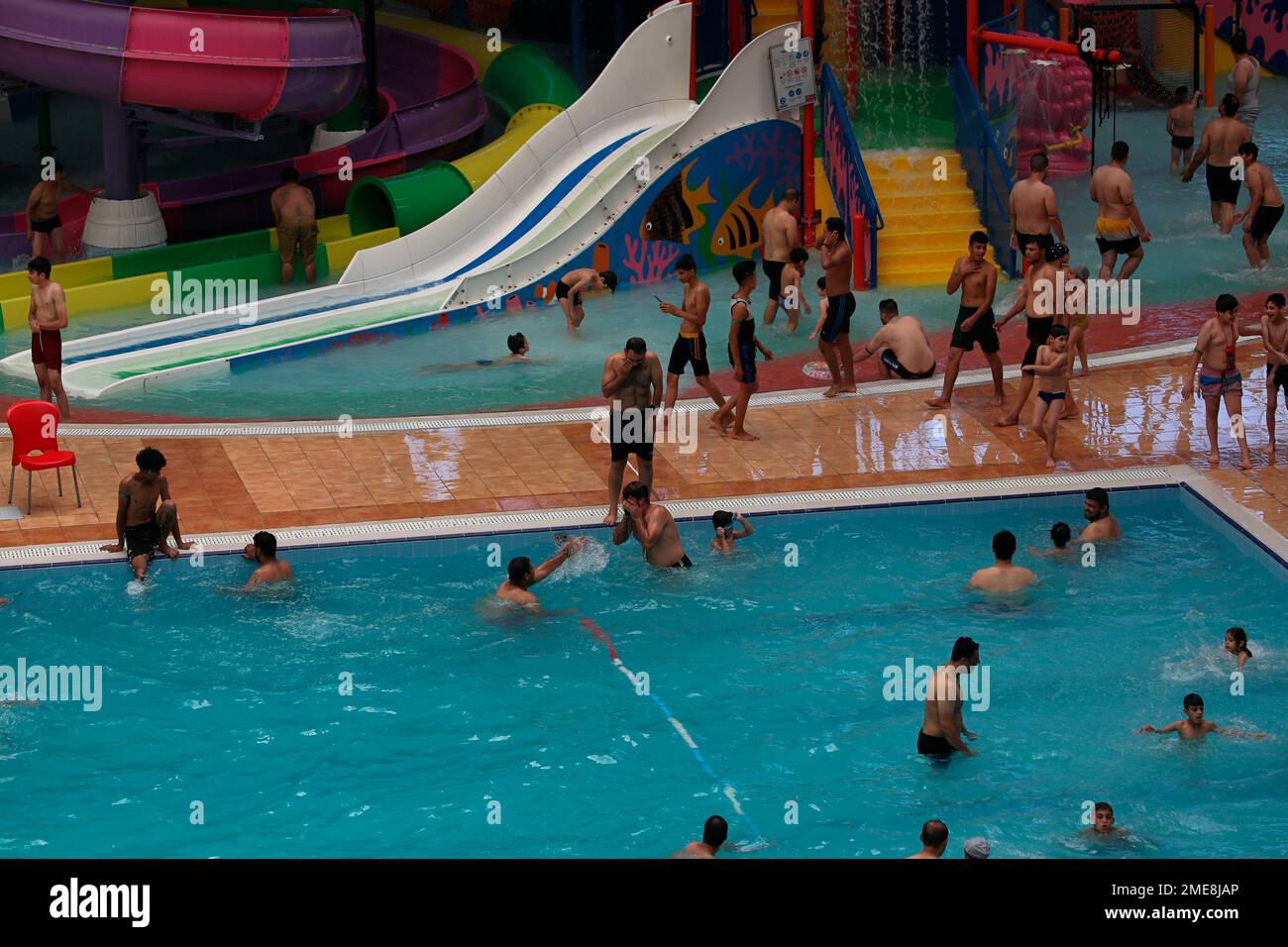 People escape the searing summer heat at Baghdad Aquatic Center in ...