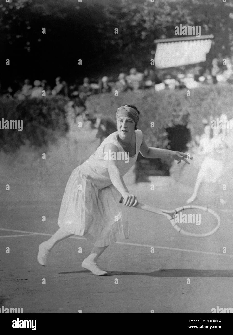 Tennis champion Suzanne Lenglen is shown in action in France, 1926 ...