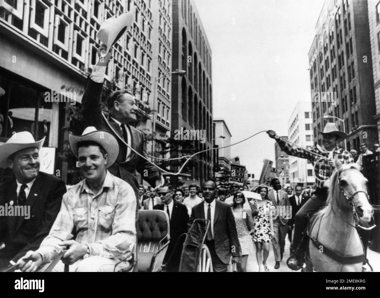 Governor Nelson Rockefeller of New York, lariat draped around his neck ...