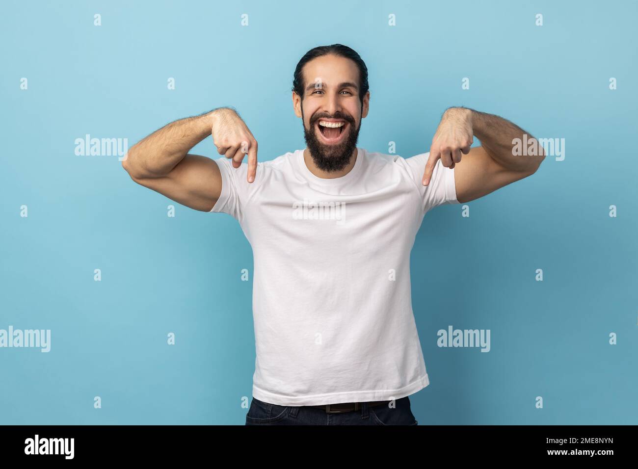 Look at ads below. Portrait of man with beard wearing white T-shirt ...