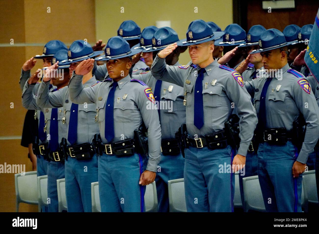 Newly sworn members of the Mississippi Highway Safety Patrol salute as ...