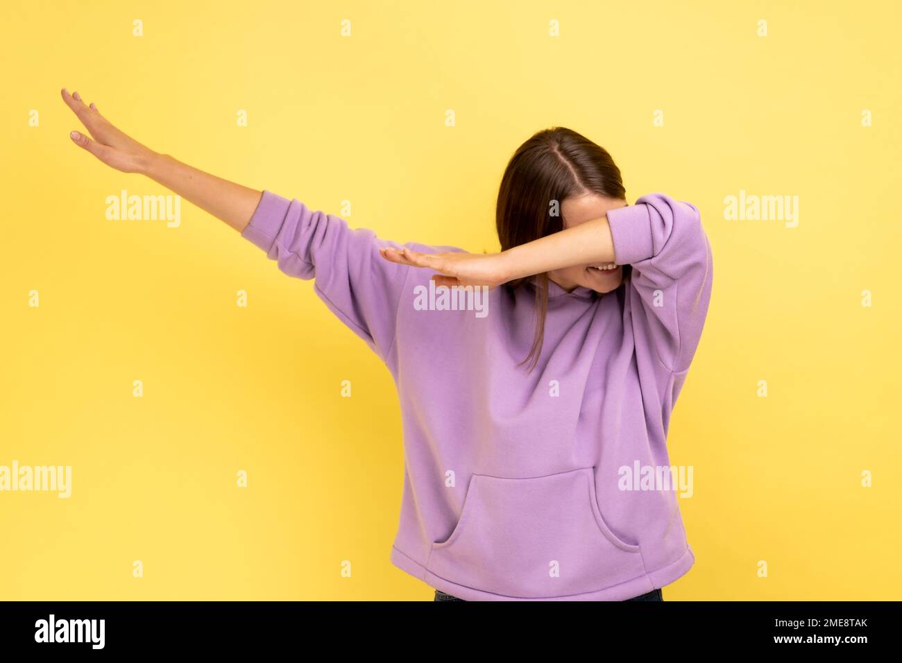 Winning, success gesture. Portrait of woman showing dab dance pose ...