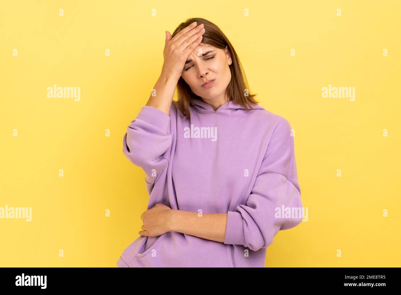 Sad Woman With Dark Hair Making Facepalm Gesture Keeping Hand On Head