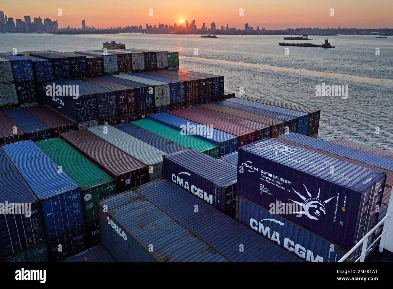 The sun rises as a container carrying a replica of the Statue of ...