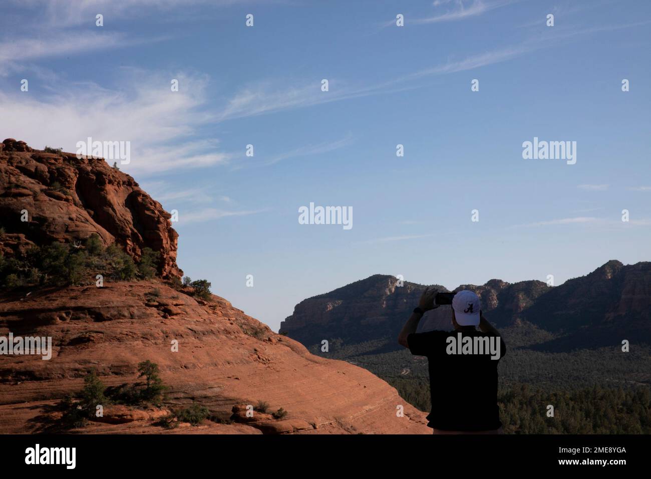 A tourist takes a photo from Chicken Point Overlook in the Coconino ...