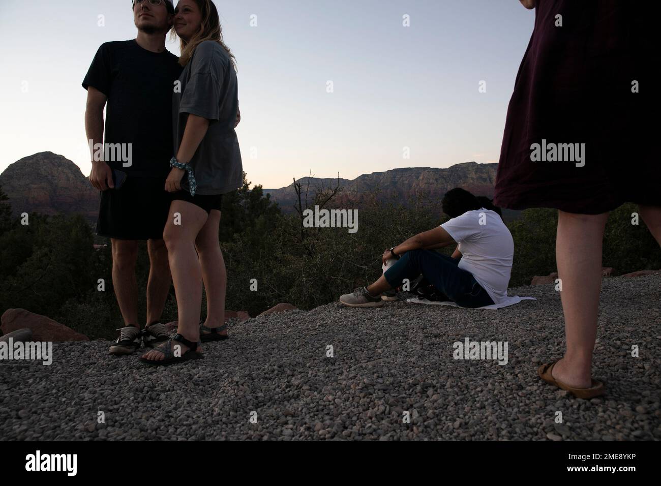 People watch the sun set from the Sedona Airport Scenic Lookout in ...