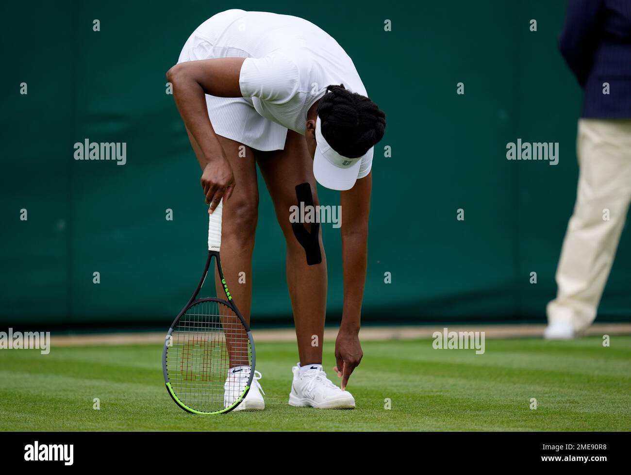 Venus Williams of the US adjusts her shoe during the women's singles ...