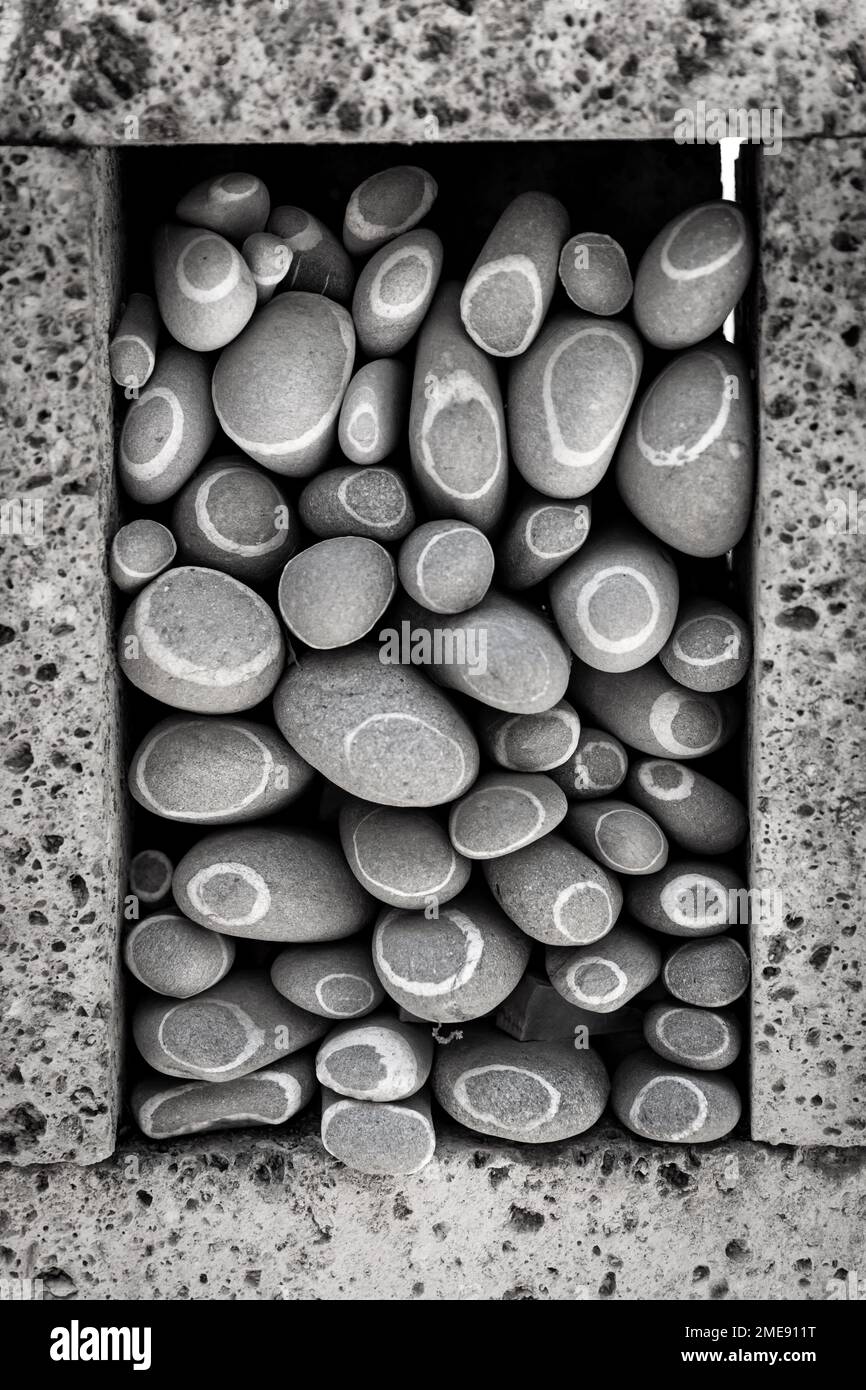 Collection of grey white-ringed stones at Dreamwoods Park, hidden in ...