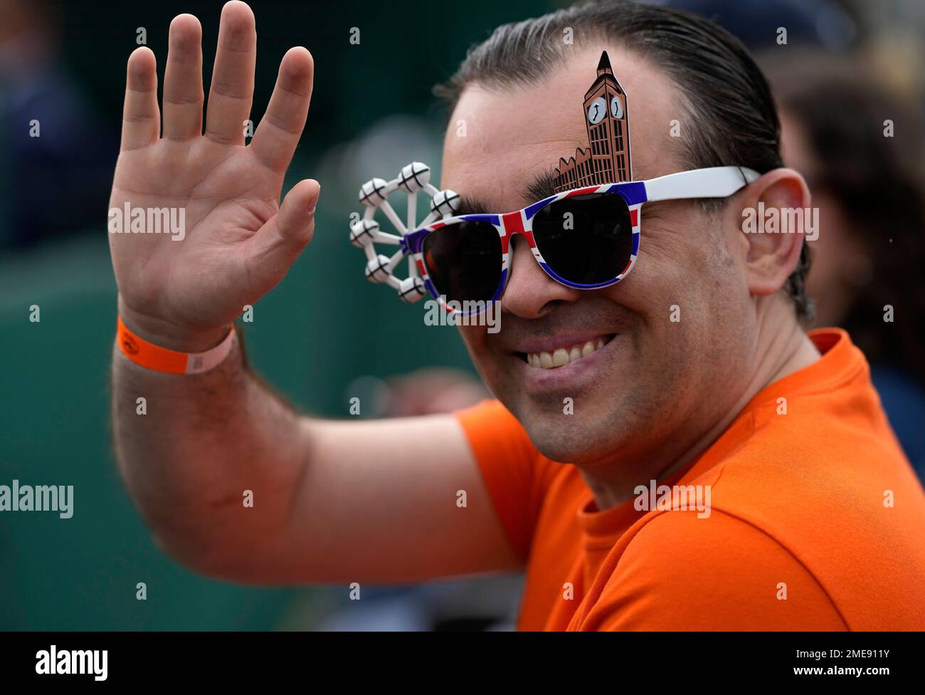A spectator wearing novelty glasses sits on Court 6 on day two of the ...