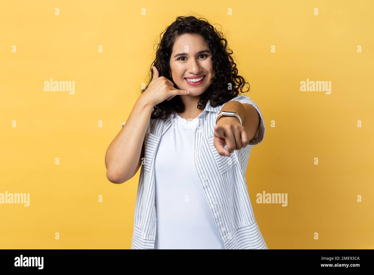 Hey you, call me back, let's contact by phone. Portrait of woman with ...