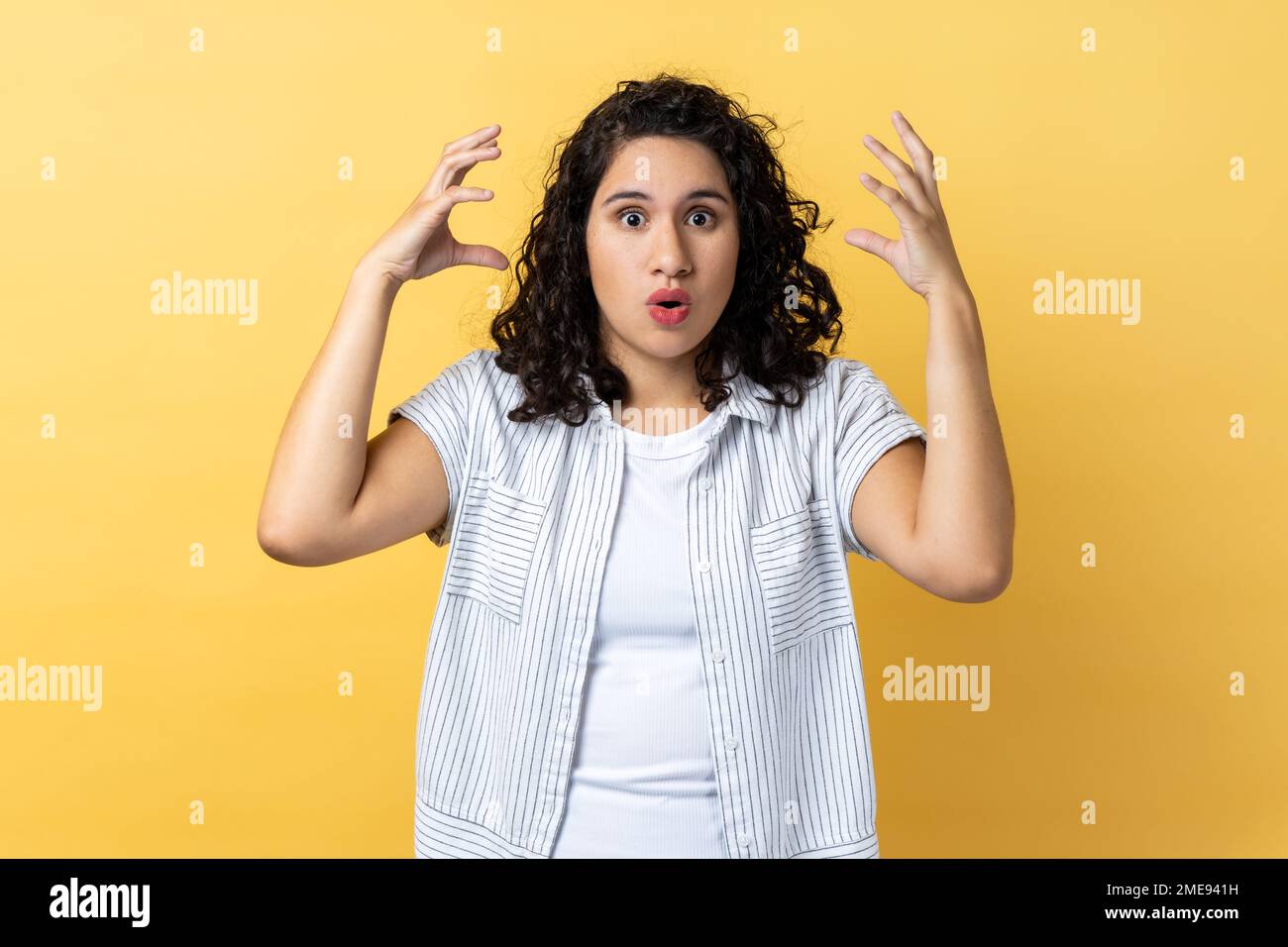 Portrait of exhausted tired woman with dark wavy hair showing mind ...