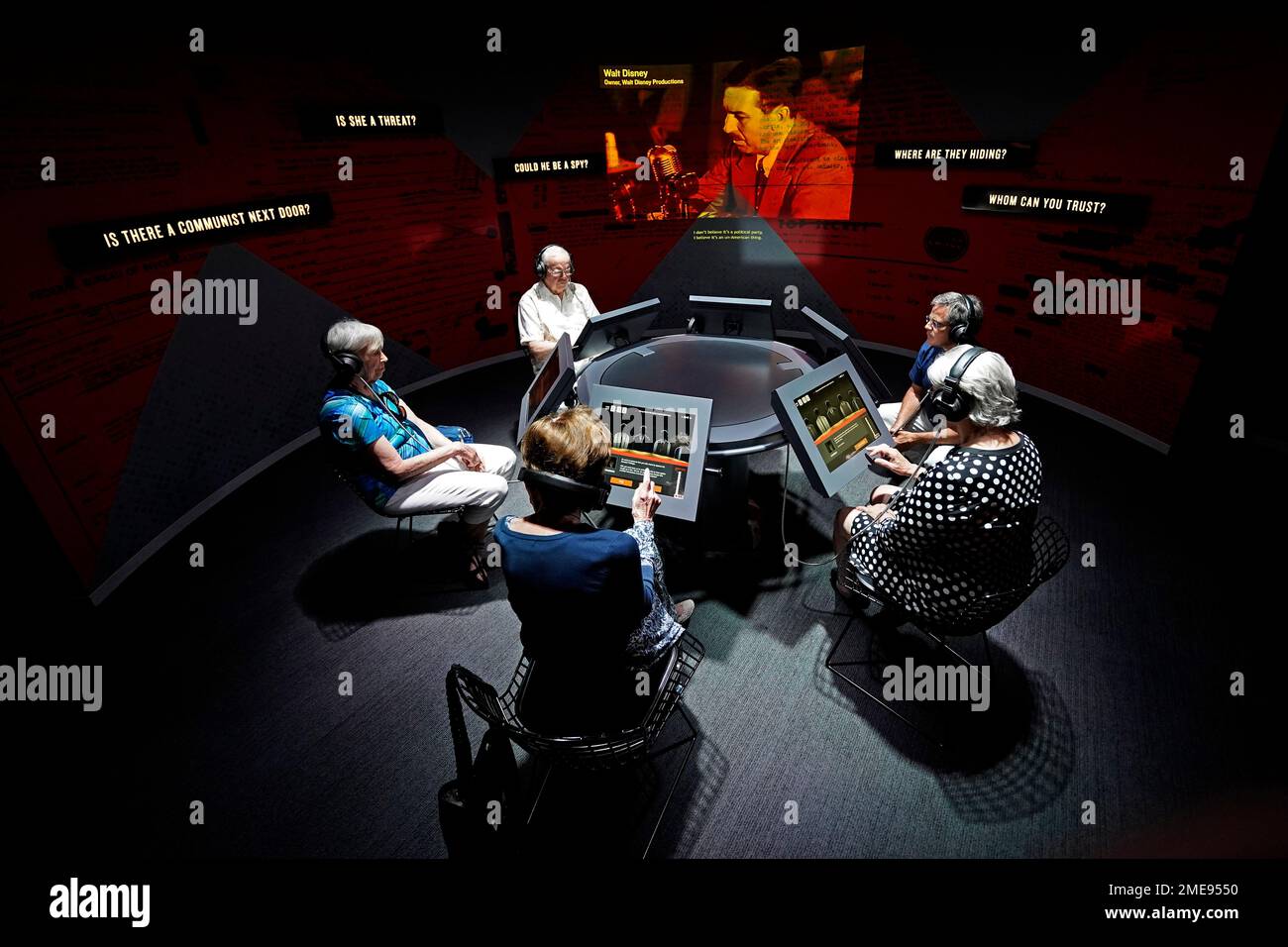 People take part in an interactive exhibit about the red scare during a ...