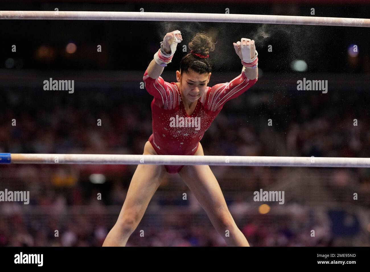 Kayla DiCello misses the bar while competing on the uneven bars during ...