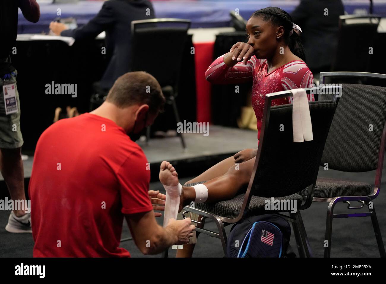 Simone Biles has her ankle taped up after competing on the beam during ...