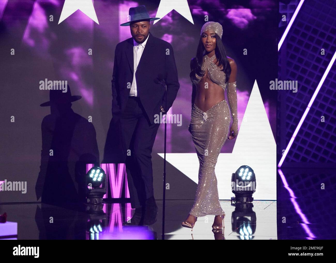 D-Nice, left, and Sevyn Streeter walk on stage to introduce a ...