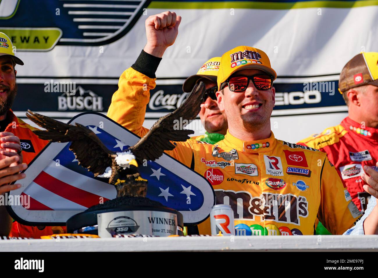 Kyle Busch celebrates with the trophy after winning a NASCAR Cup Series ...