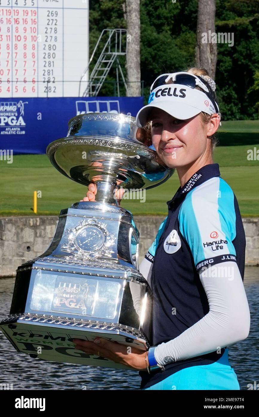 Nelly Korda of the U.S. holds the trophy after winning the KPMG Women's ...