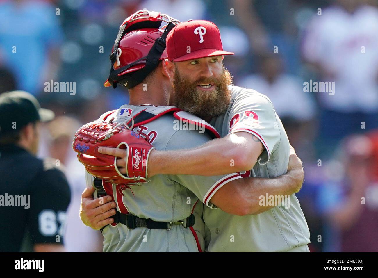 Philadelphia Phillies catcher J.T. Realmuto, left, congratulates relief ...