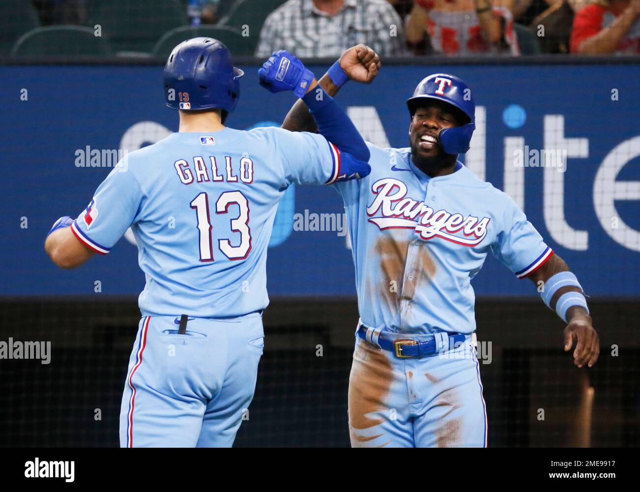 Texas Rangers' Joey Gallo, left, is greeted at home plate by Adolis ...