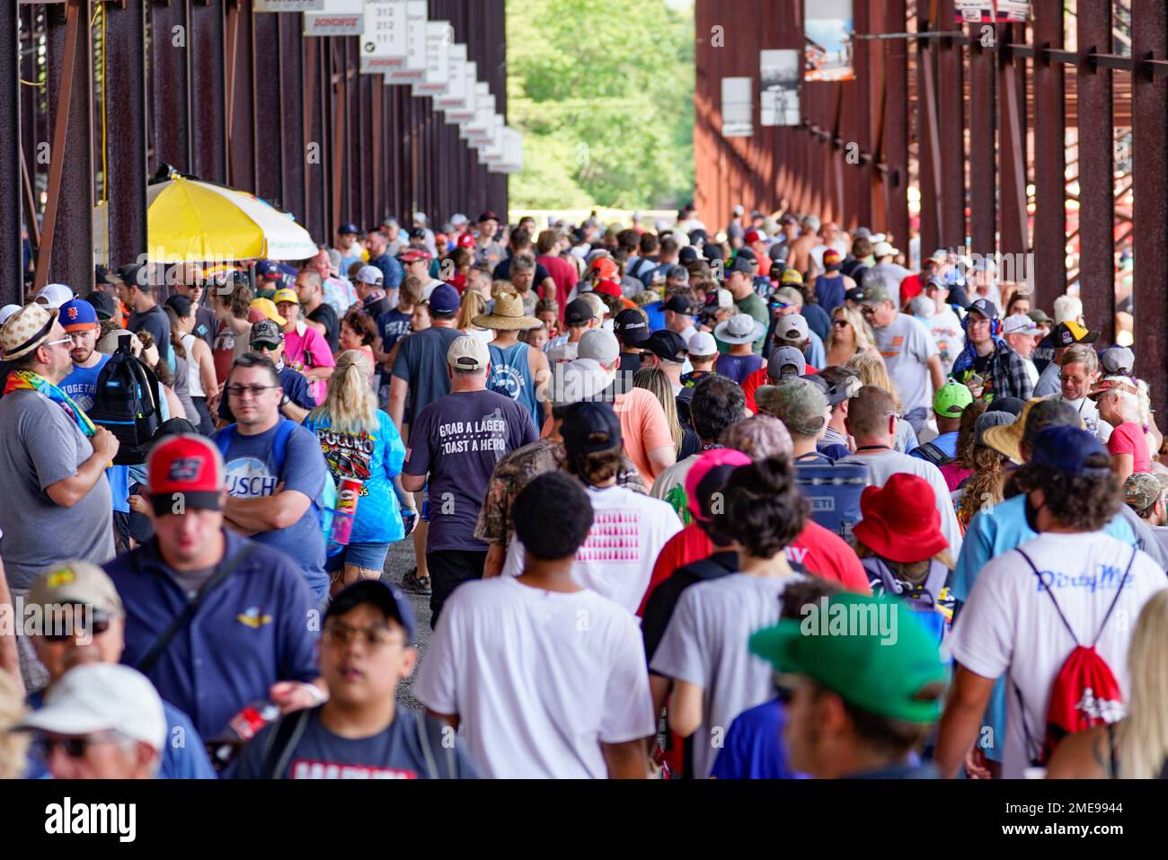 Race fans move through the aisle under the grandstand before the NASCAR ...