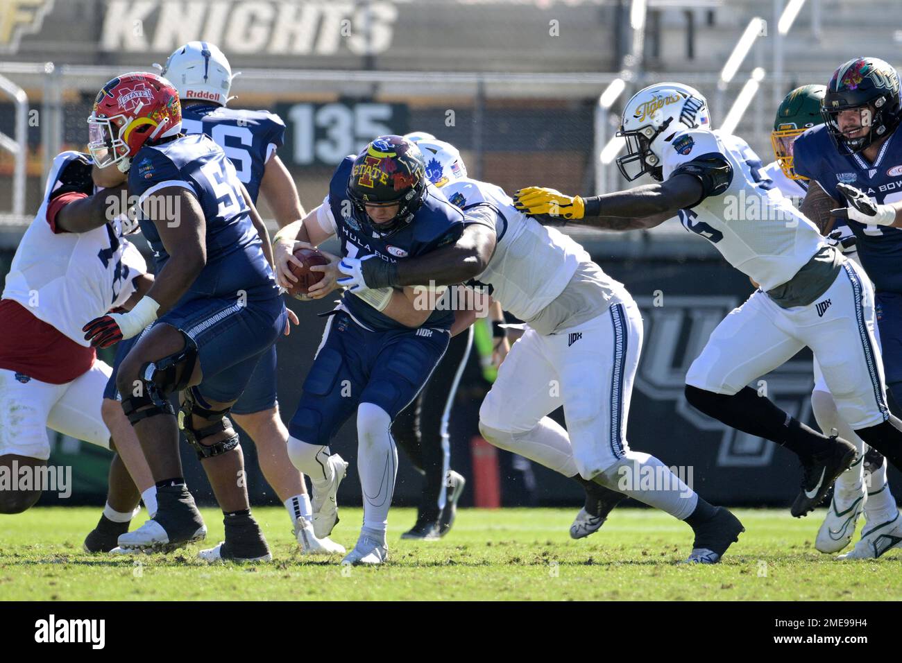 Team Aina quarterback Chase Brice, center, of Appalachian State, is ...