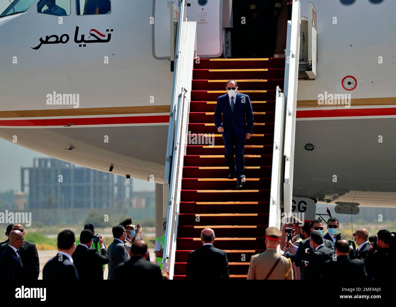 Egyptian President Abdel Fattah el-Sissi, center, arrives at an airport ...