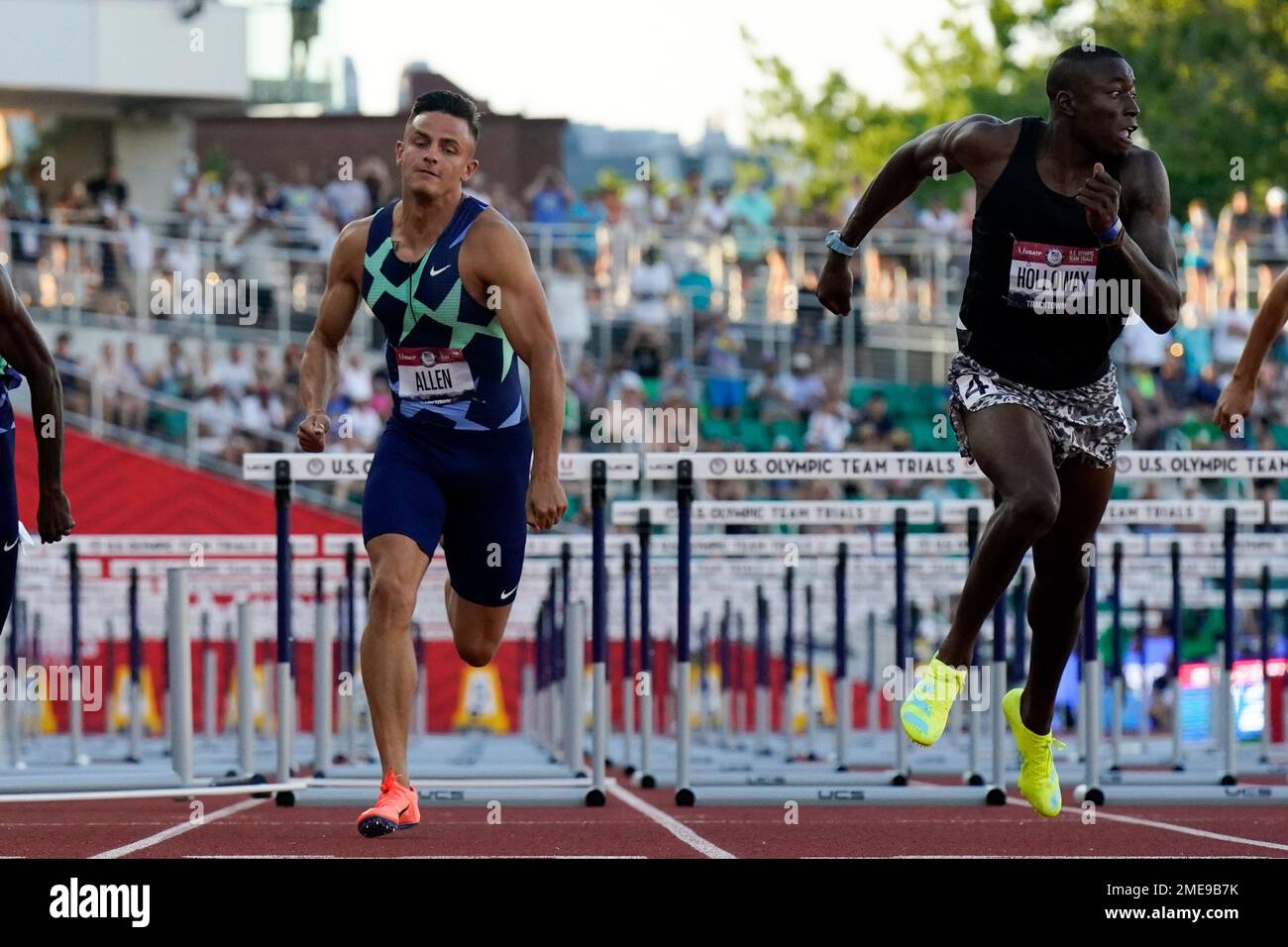 Grant Holloway, right, wins the final in the men's 110-meter hurdles ...